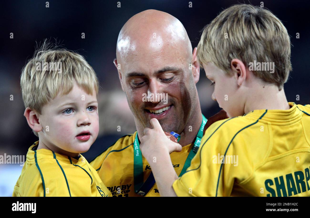Australia's Nathan Sharpe celebrates with his children after their ...