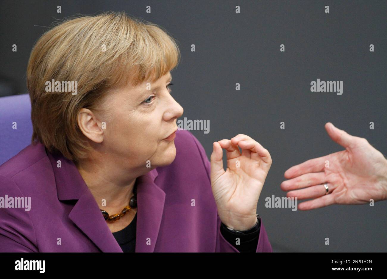 German Chancellor Angela Merkel gestures as she talks during a meeting ...