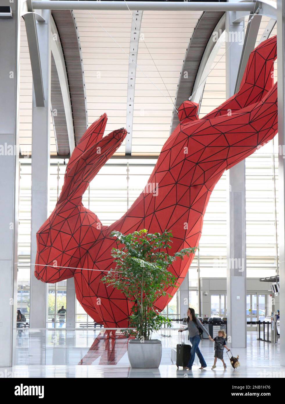 In this photo taken Wednesday Oc.t 19, 2011, visitors pass by a 56-foot ...