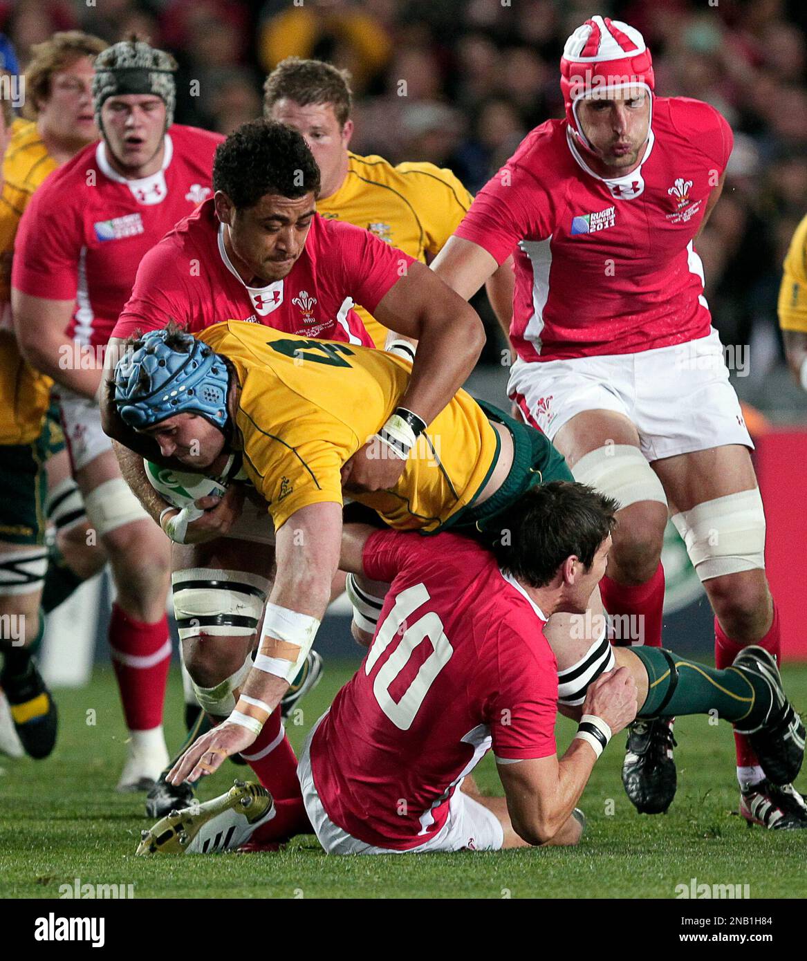 Australia's James Horwill is tackled by Wales' James Hook, (10), during ...