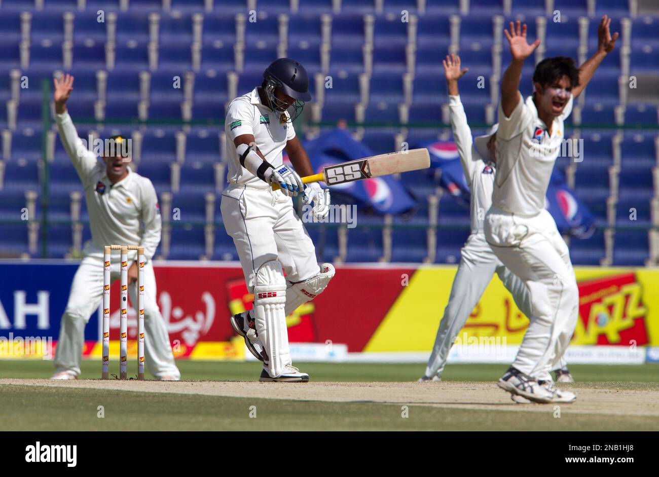 Pakistan's bowler Aizaz Cheema, right, appeals against Sri Lankan ...