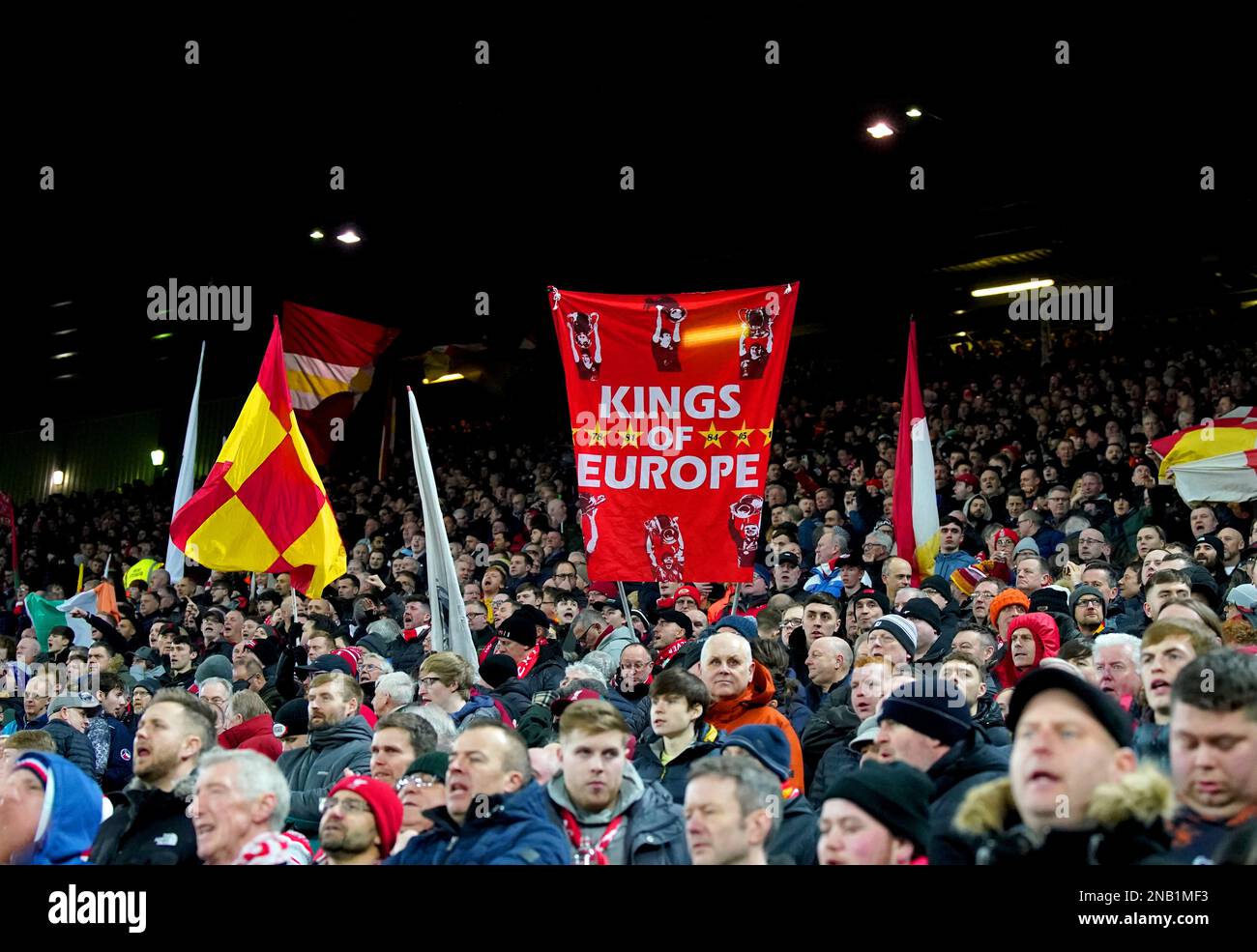 Liverpool fans hold up banners and flags in the stands during the ...