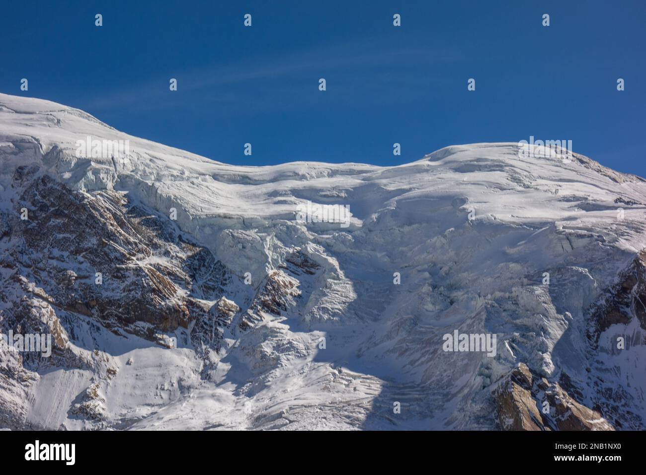 The alps of Switzerland covered with the snow under blue sky Stock ...