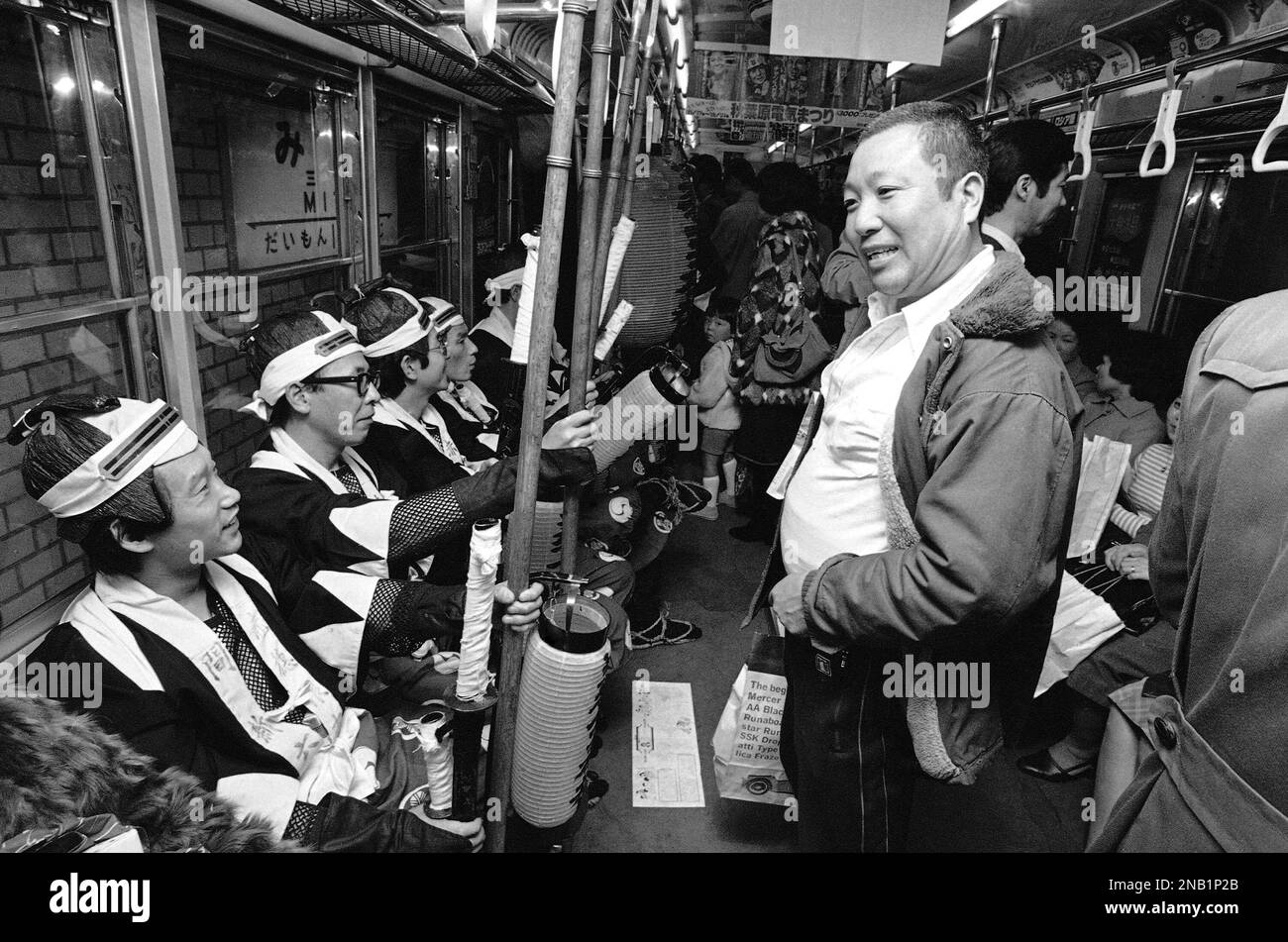 Friday night reveler, right, chats with fellow passengers aboard a ...