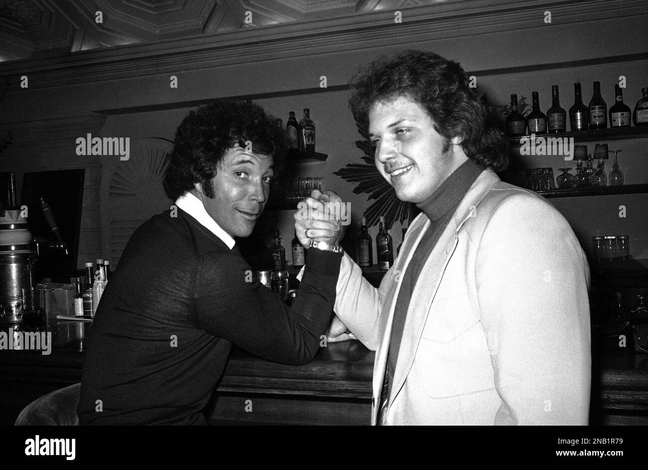 British singer Tom Jones arm wrestling with his son Mark, 18, during ...