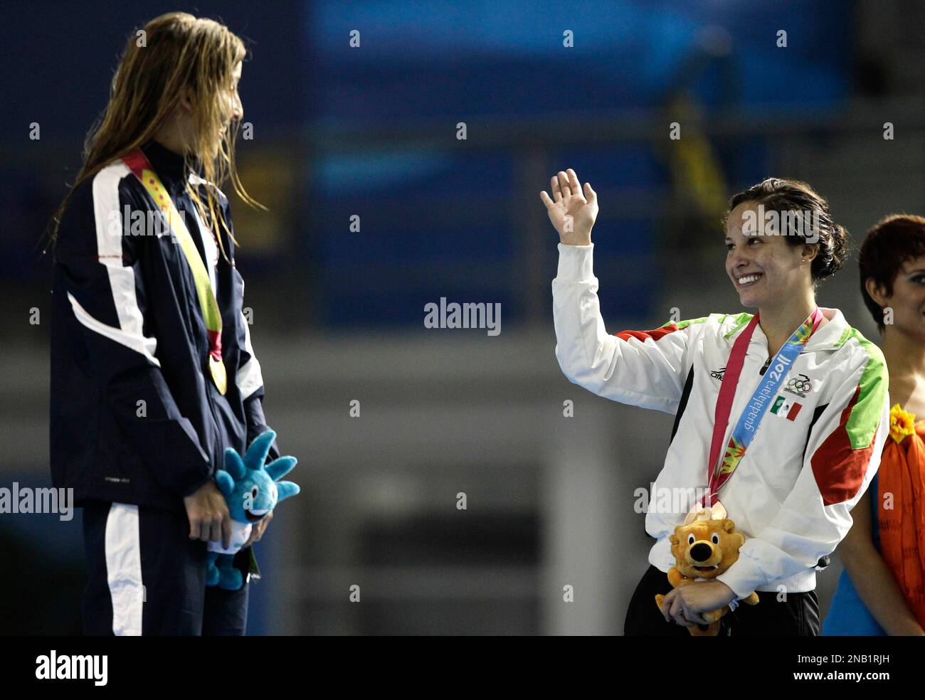 Kimberly Vandenberg, of the United States, gold medal, left, looks as ...