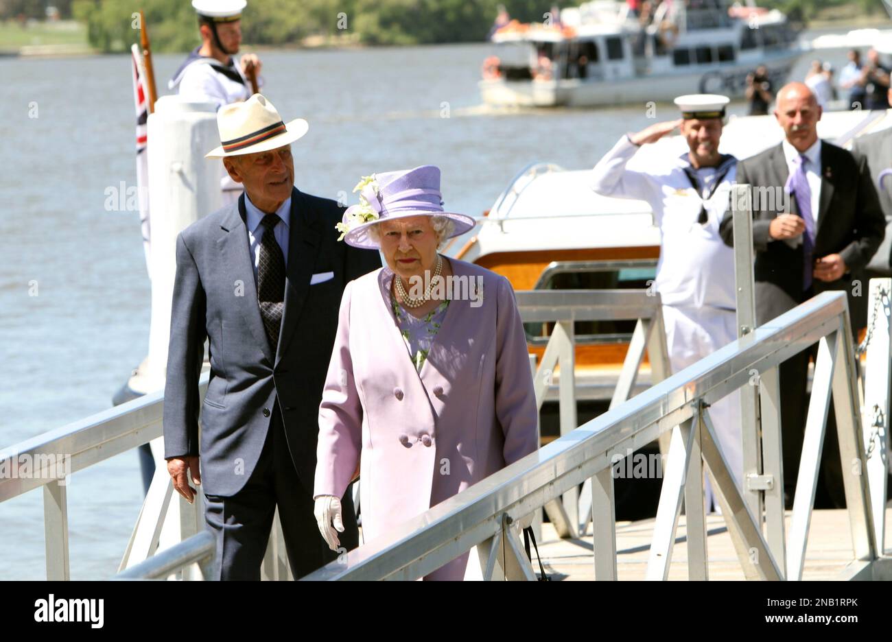 Queen Elizabeth II, right, and Prince Philip, left, arrive by boat on ...