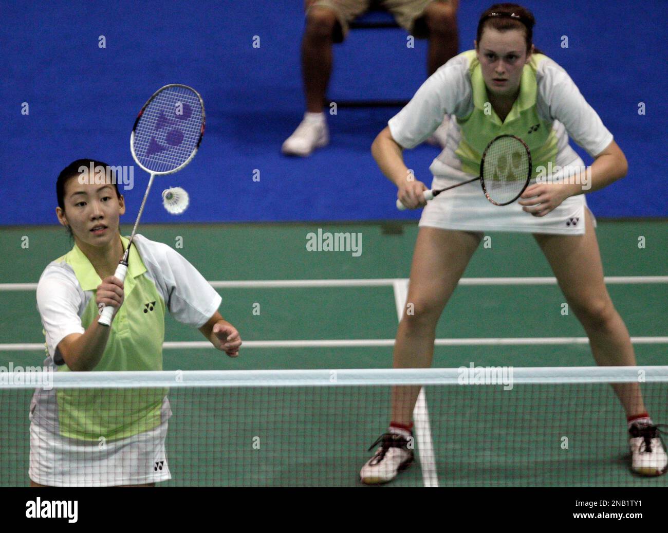 Canada's Li Michelle, left, returns the shuttlecock as teammate Alex ...