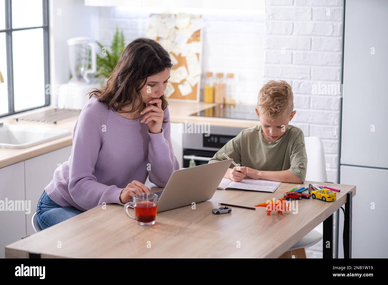 Work from home and family education, Mom and son using remote access ...