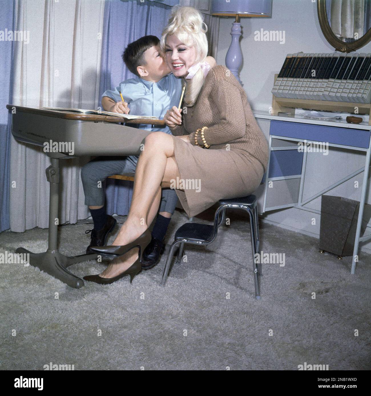 Mamie Van Doren with her 7-year-old son Perry in their Hollywood Hills home, Los Angeles, Dec. 9 ...