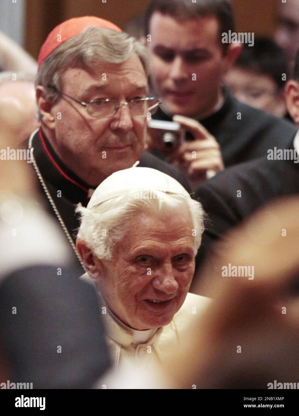 Pope Benedict XVI, followed by Australian Cardinal George Pell, arrives ...