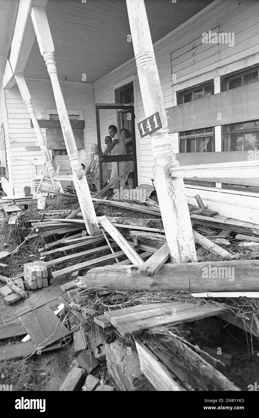 Charles Pelfrey and his family of Biloxi, Miss., survey the damage to ...