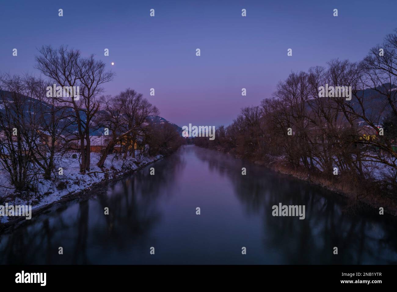 Color Enns river in sunrise frosty morning in Admont town in Austria ...