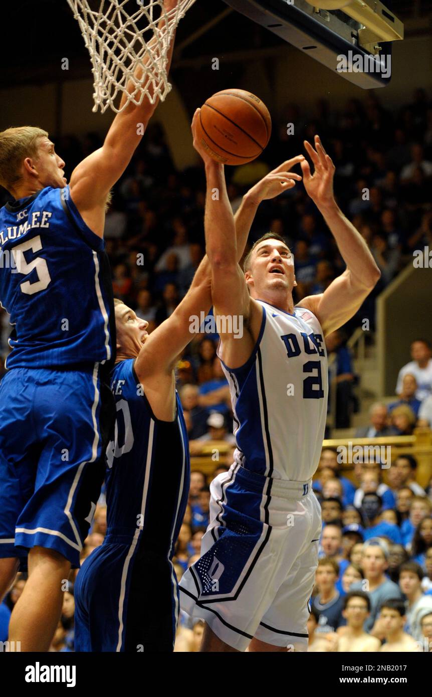 Duke's Miles Plumlee (21) is blocked by his brothers Mason Plumlee (5 ...