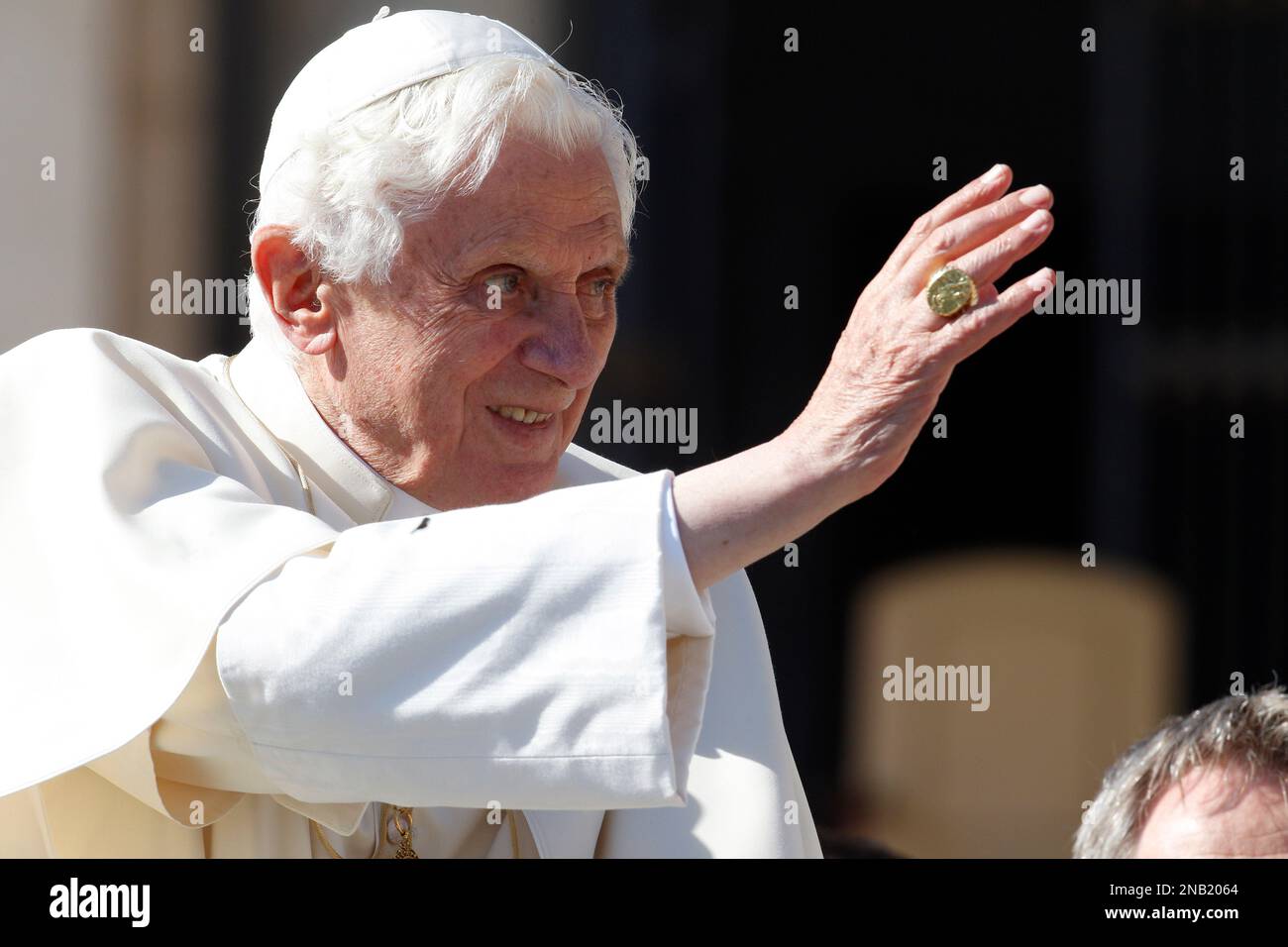 Pope Benedict XVI waves during a general audience in St. Peter's Square ...