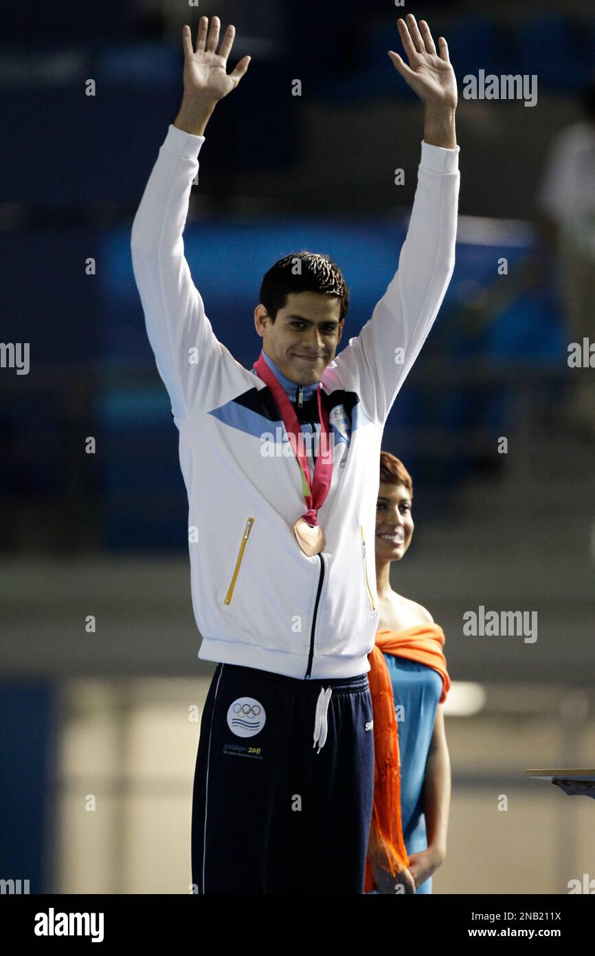 Argentina's Juan Pereyra celebrates on the podium after winning the ...