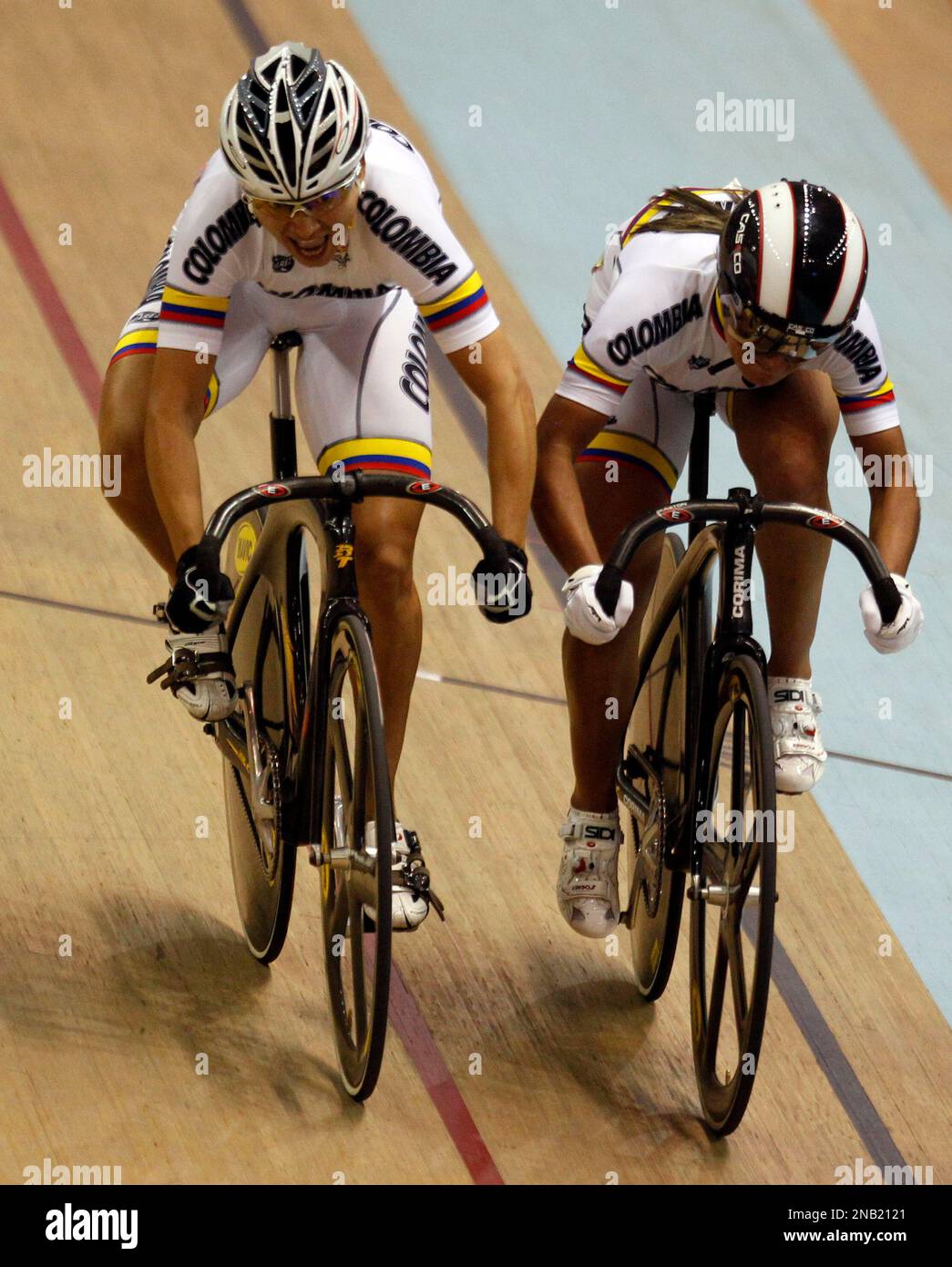 Colombia's Diana Garcia, left, speeds up past Colombia's Juliana ...