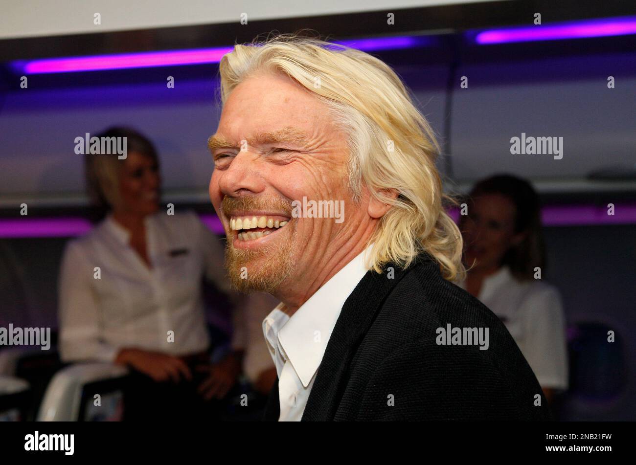 Virgin Group Founder Sir Richard Branson smiles as he stands in front ...