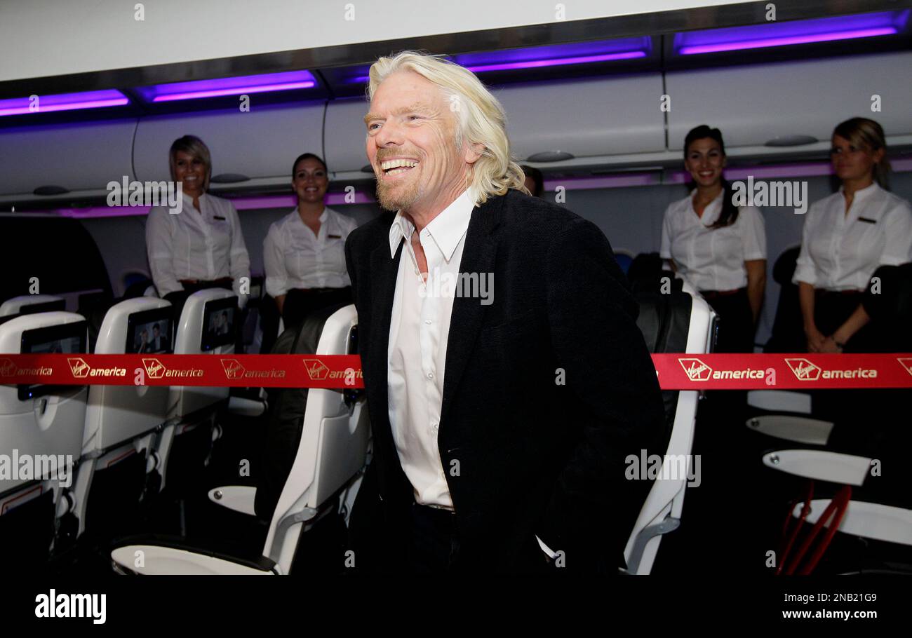 Virgin Group Founder Sir Richard Branson poses in front of a Virgin ...