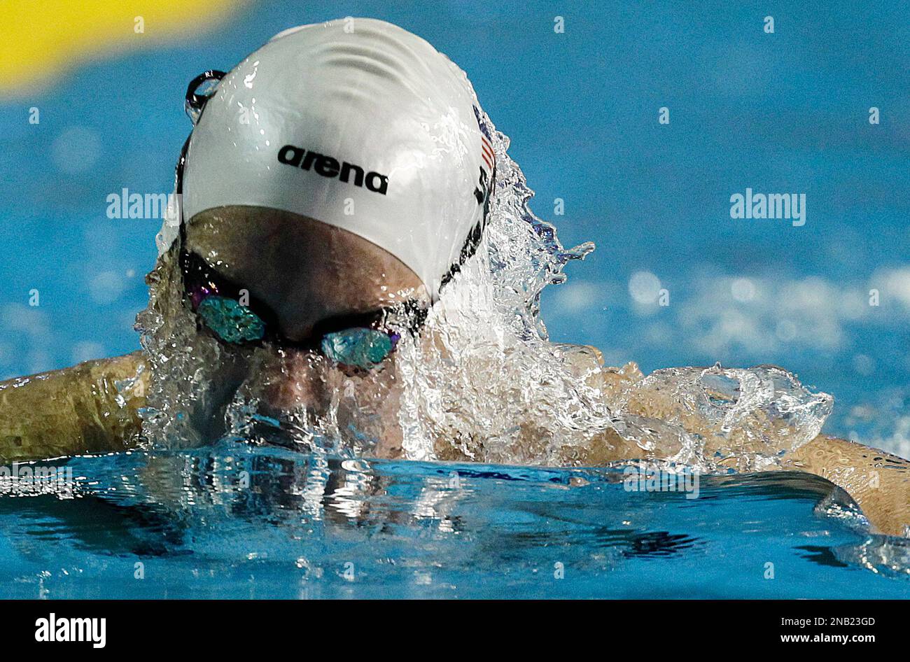 Julia Smit, of the United States, breaks the surface of the water while ...