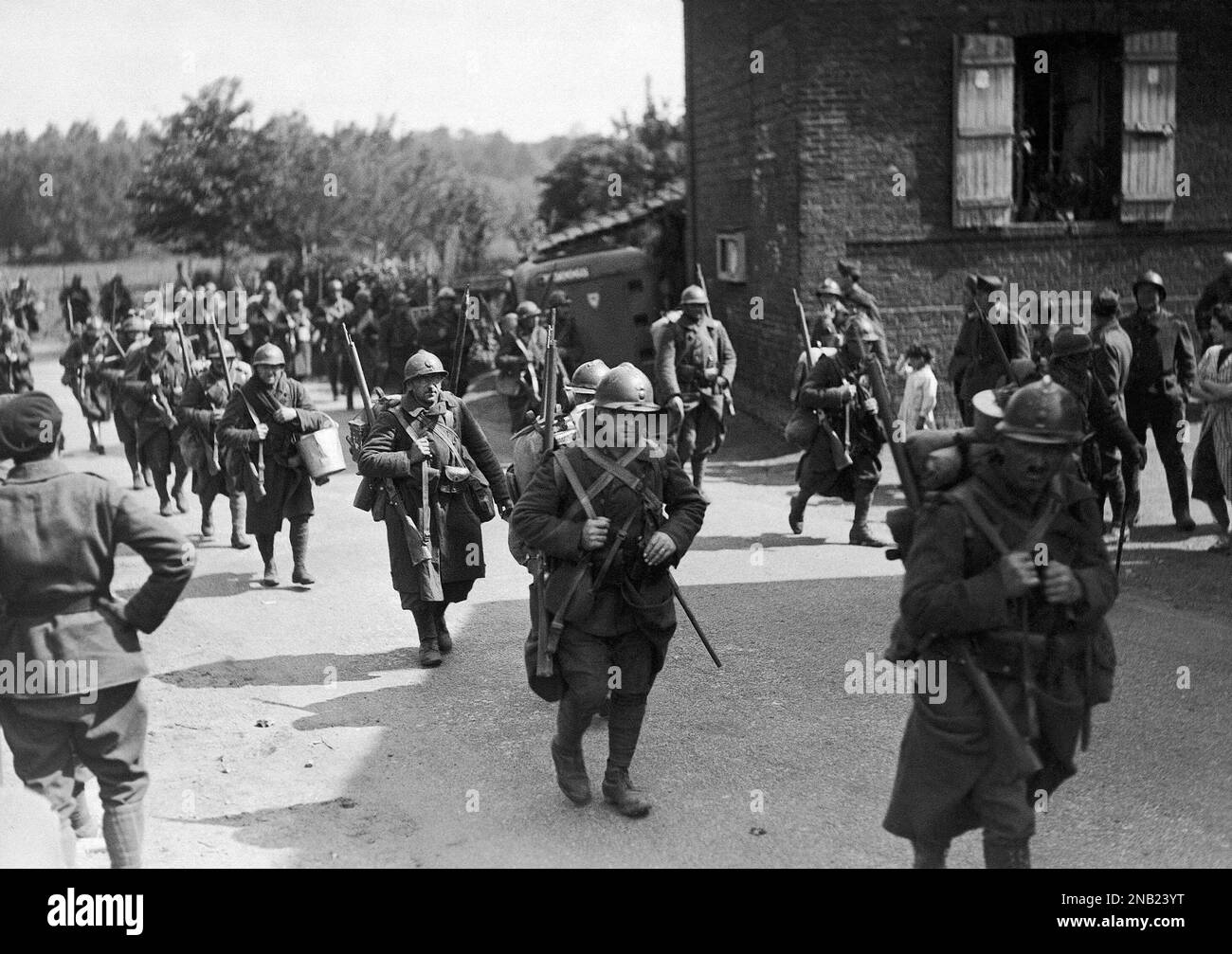 French infantrymen move up to the front line pass, with their full ...