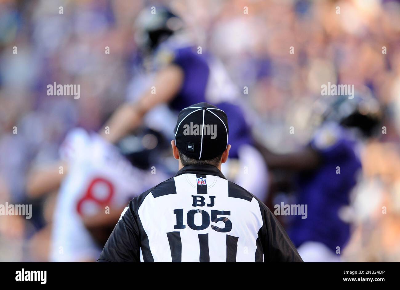 Back judge Dino Paganelli watches action in the first half of an NFL ...
