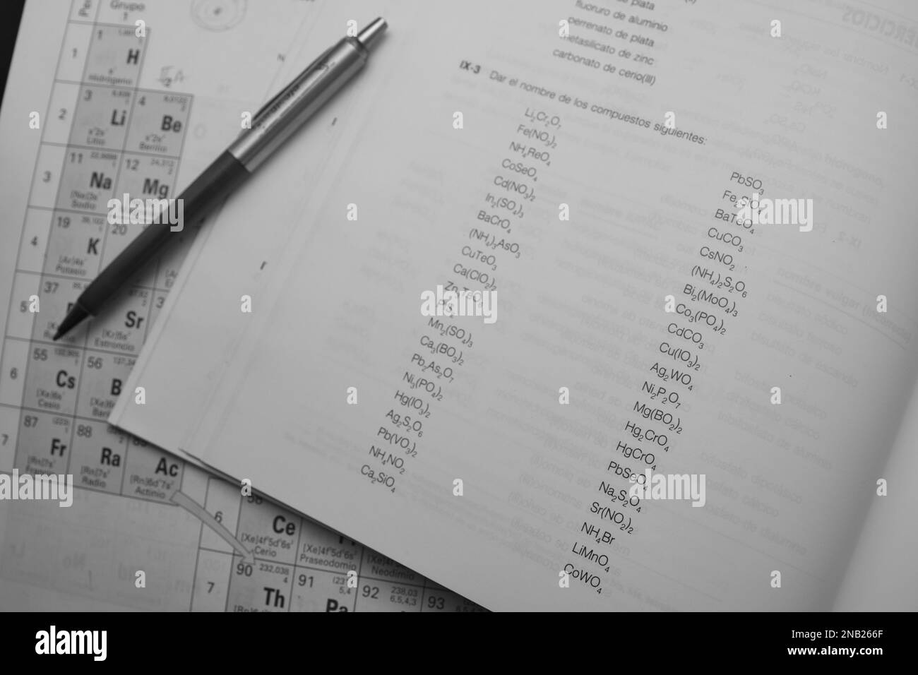 Close-up of a chemistry book with chemical formulation exercises next ...