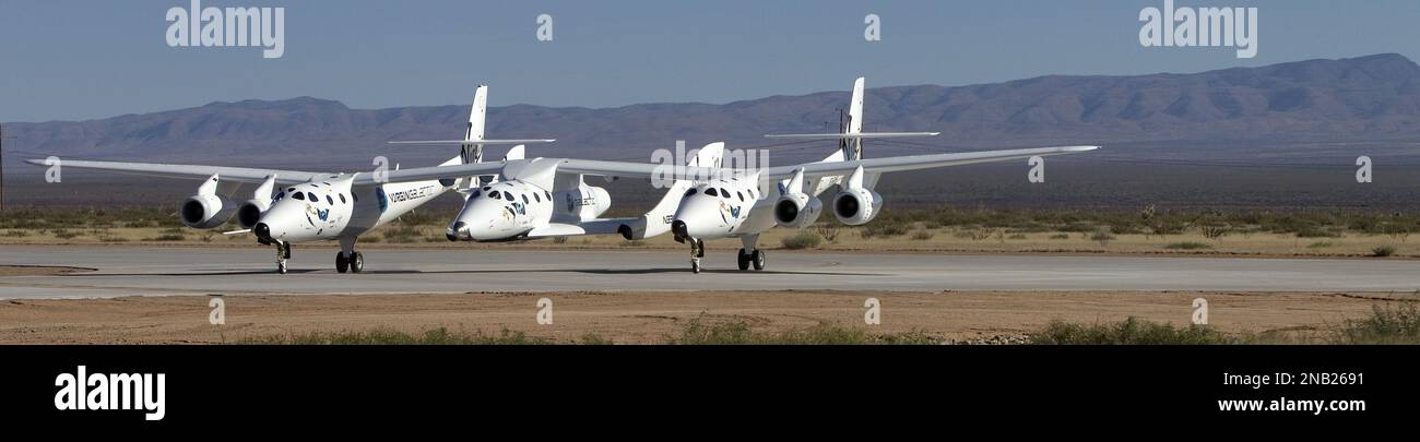 The spacecraft SpaceShipTwo, center, carried by cargo aircraft ...