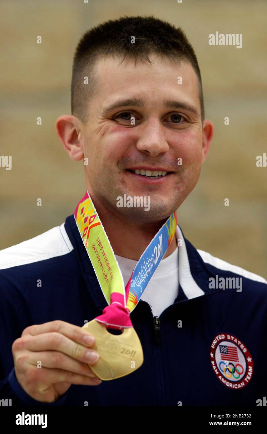 Gold medal winner U.S. Matthew Lee Rawlings holds his medal as he poses ...
