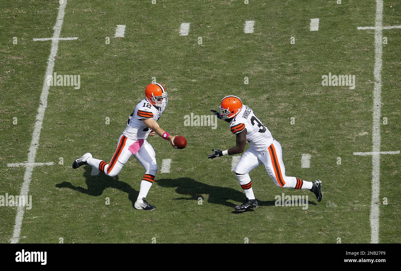 Cleveland Browns quarterback Colt McCoy (12) hands off to running back ...