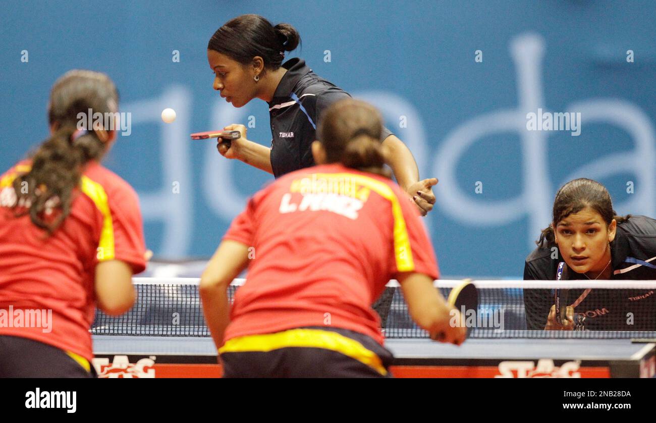 Venezuela's Joheny Valdez eyes the ball as her teammate Eva Brito looks ...