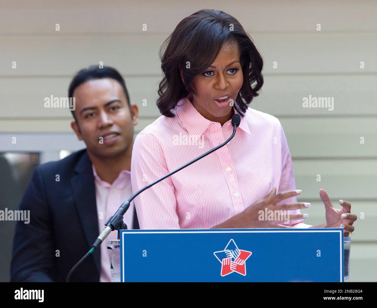 First lady Michelle Obama speaks outside the home of Army Sgt. Johnny ...