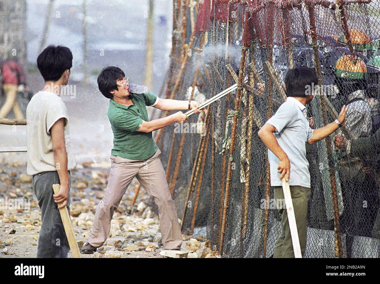 South Korean students and riot policeman duel with wooden sticks during ...