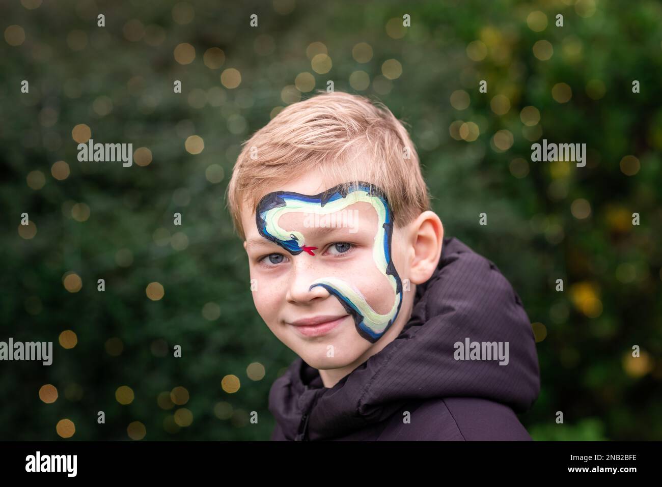 Cute little boy with face paint. Face painting, kid painting face at ...
