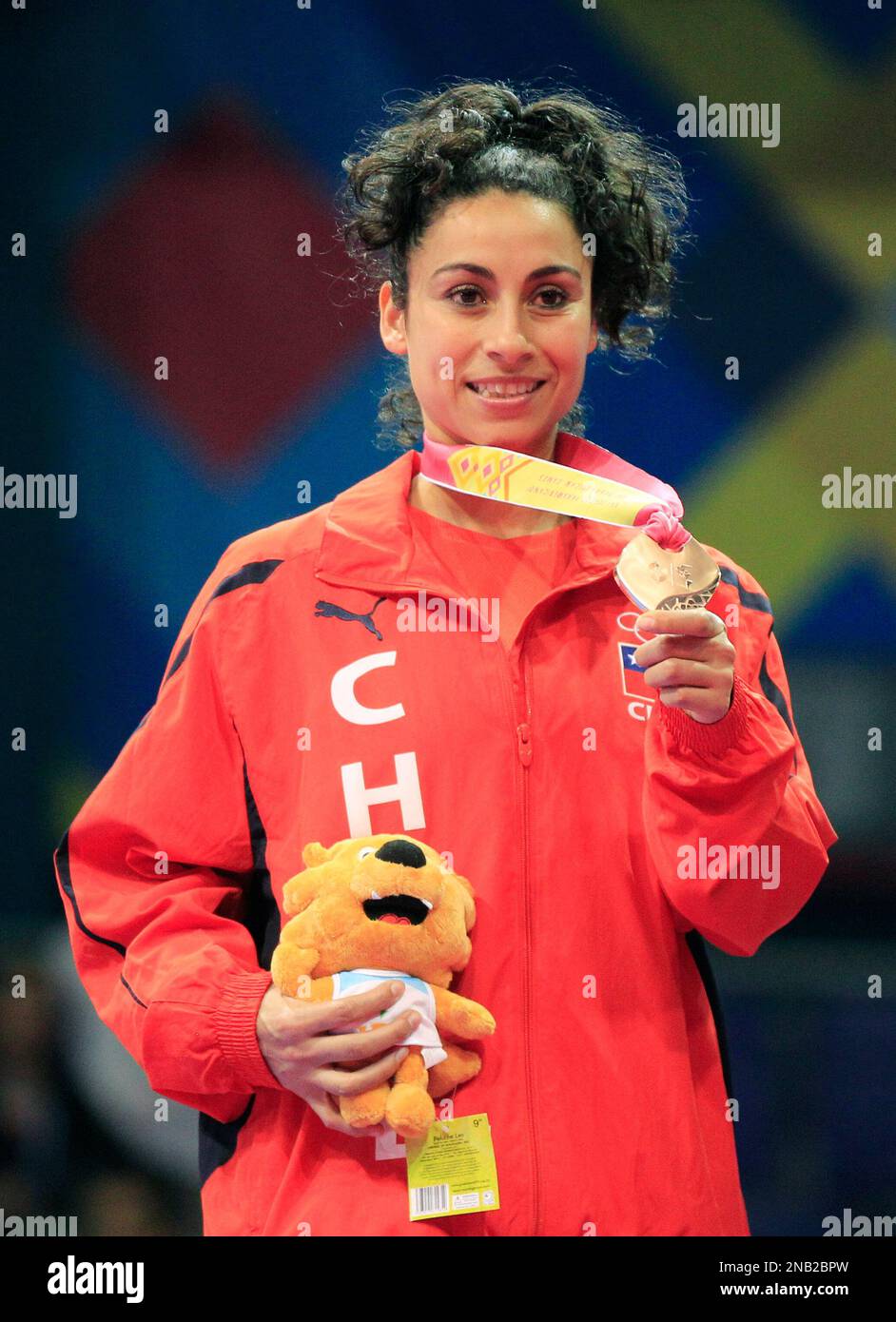 Bronze medal Chile's Yeni Contreras holds up her medal as she poses for ...