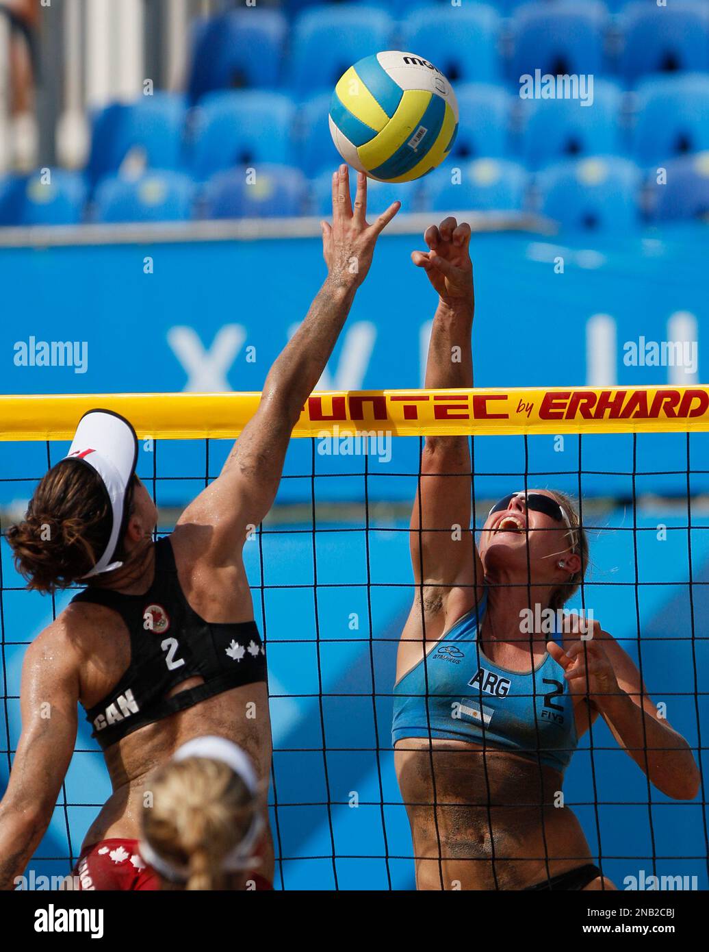 Canada's Elizabeth Maloney, left, returns the ball as Argentina's Maria ...