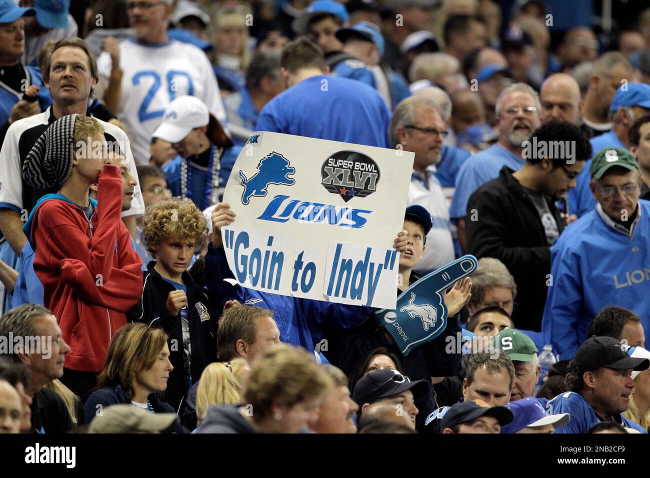 Detroit Lions fans hold up a sign during the third quarter of an NFL ...