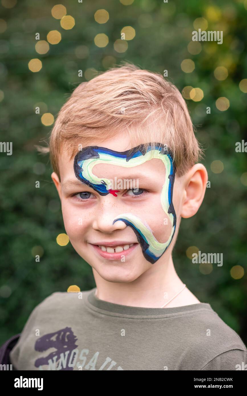 cute-little-boy-with-face-paint-face-painting-kid-painting-face-at