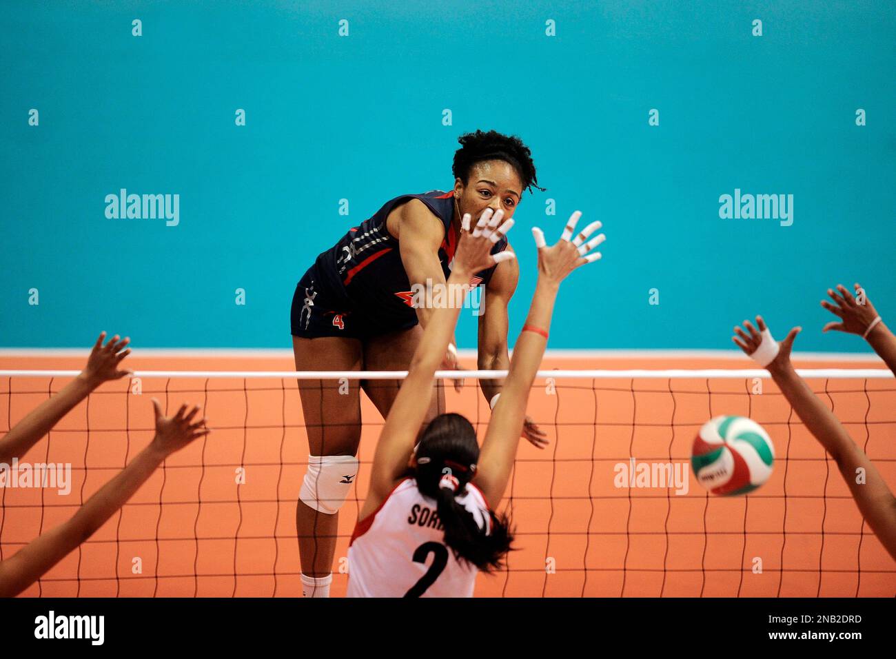 Angela Forsett, of the United States, spikes the ball during a women's ...