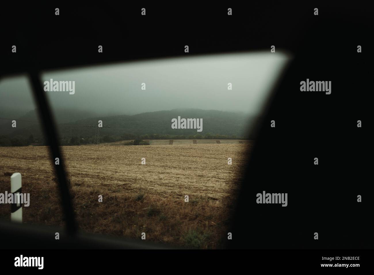 A beautiful view out the car window of a field and forest Stock Photo ...