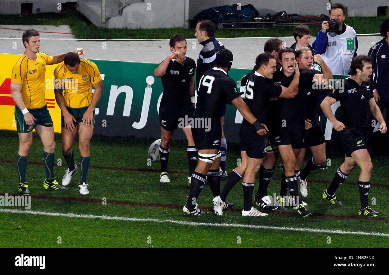 Australia's Rob Horne, left, consoles teammate Quade Cooper as the New ...
