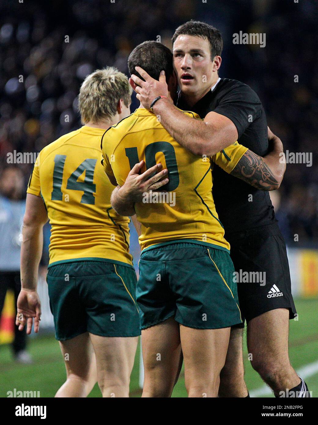 New Zealand All Blacks Richard Kahui embraces Australia's Quade Cooper ...