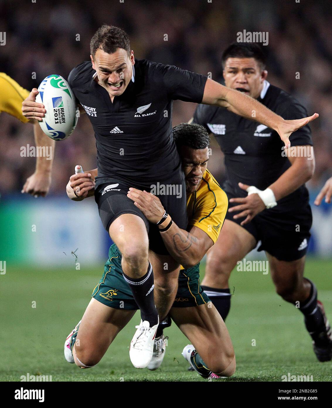 New Zealand All Blacks Israel Dagg is tackled by Australia's Digby ...