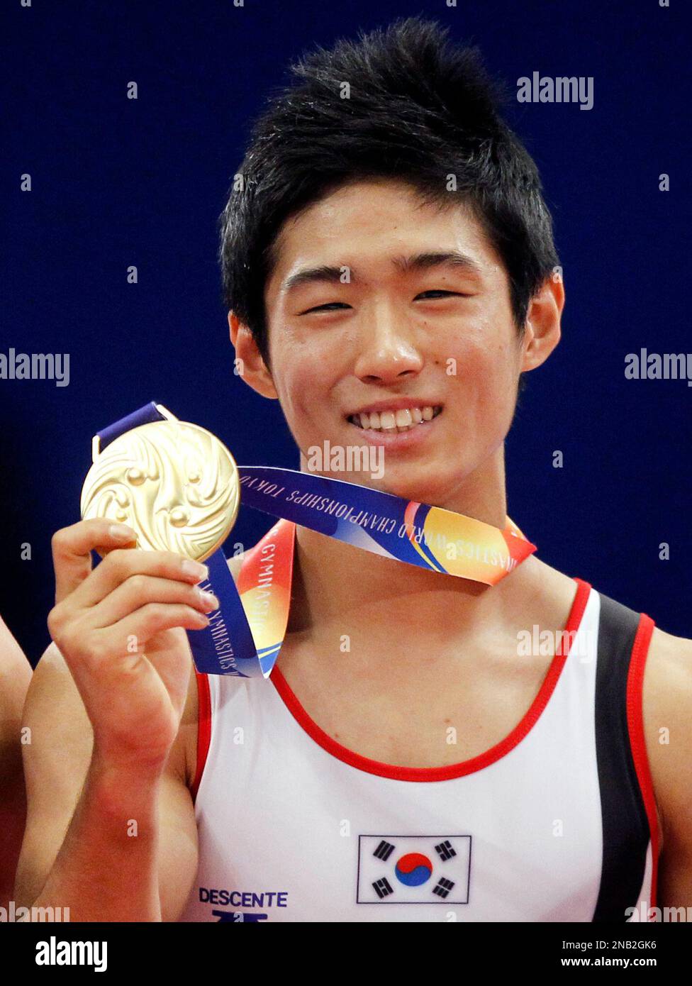 Gold medalist Yang Hak-seon of South Korea smiles on the podium after ...