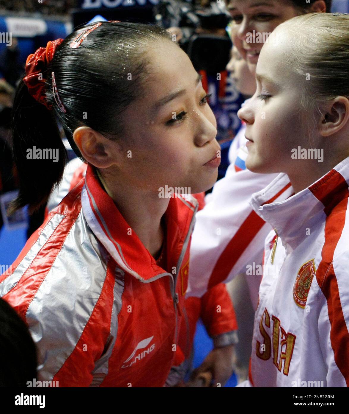 Gold medalist Sui Lu of China, left, greets a Russia's gymnast after ...