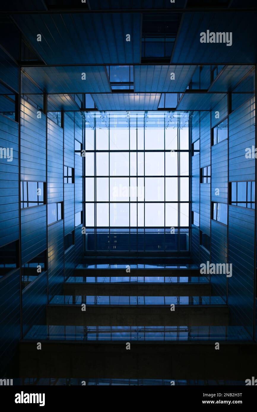looking up inside modern architecture glass building Stock Photo - Alamy