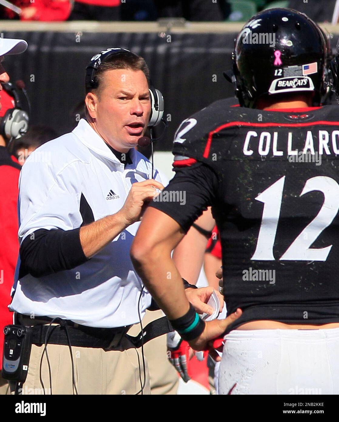 Cincinnati head coach Butch Jones talks with quarterback Zach Collaros ...
