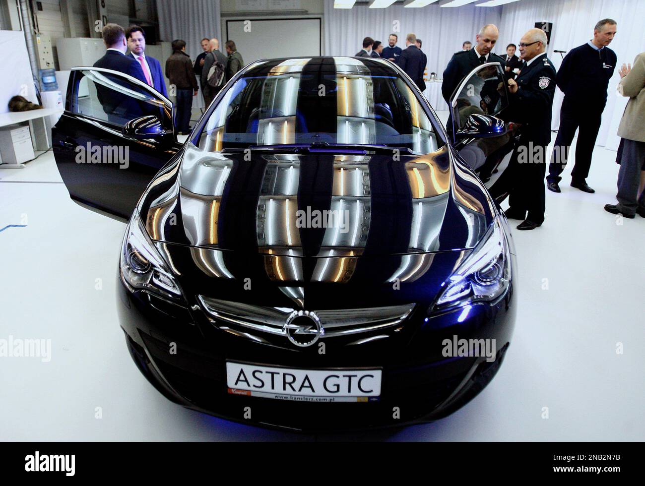 Guests watch the new model duringceremony of launching the production ...