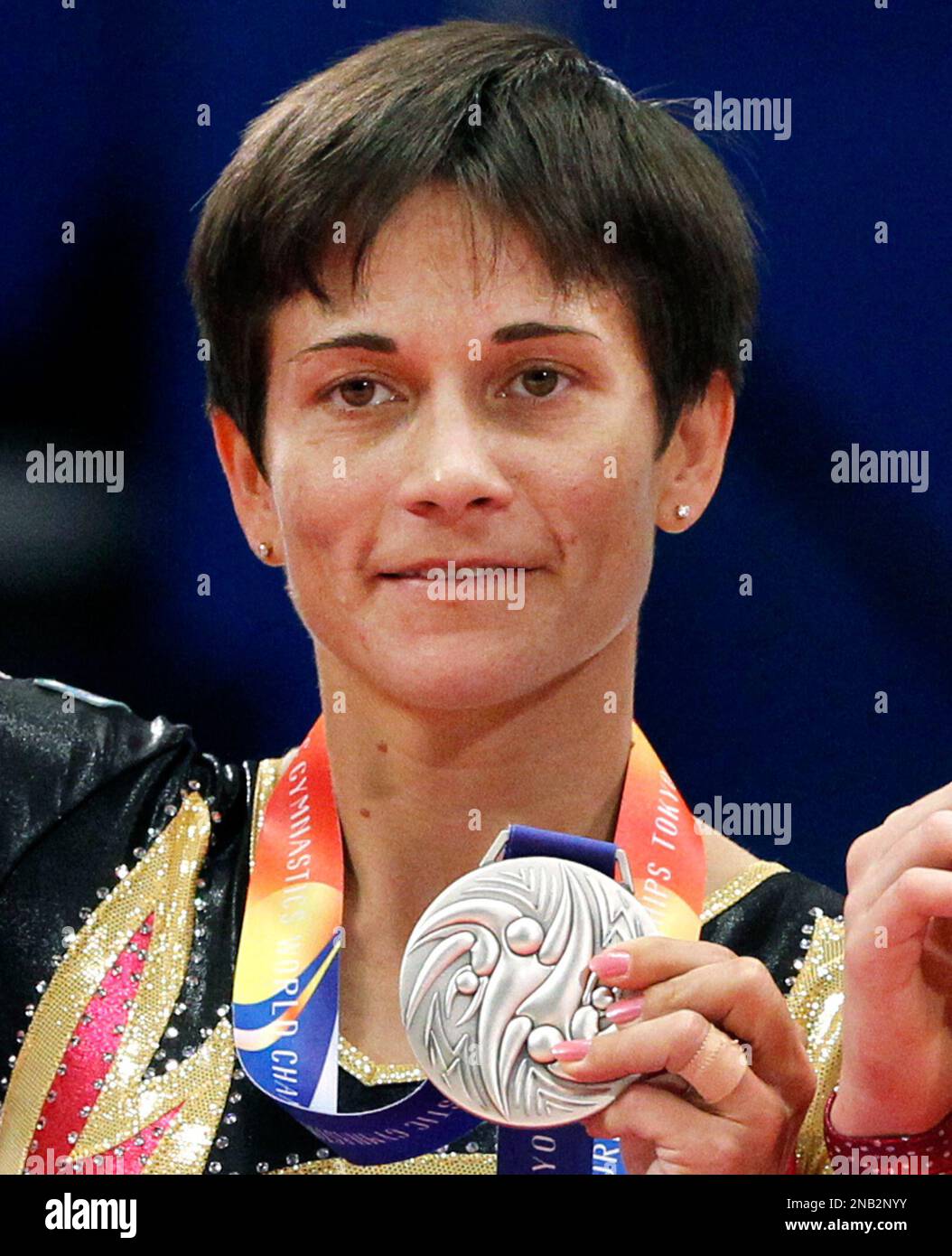 Germany's Oksana Chusovitina poses with the silver medal on the podium ...