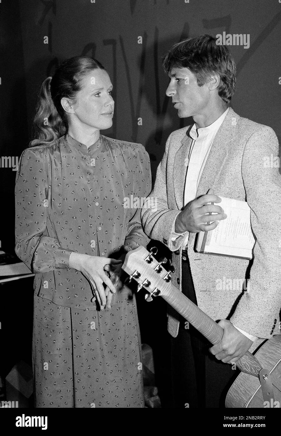 Actress Liv Ullmann and singer John Denver chat after an award ceremony ...